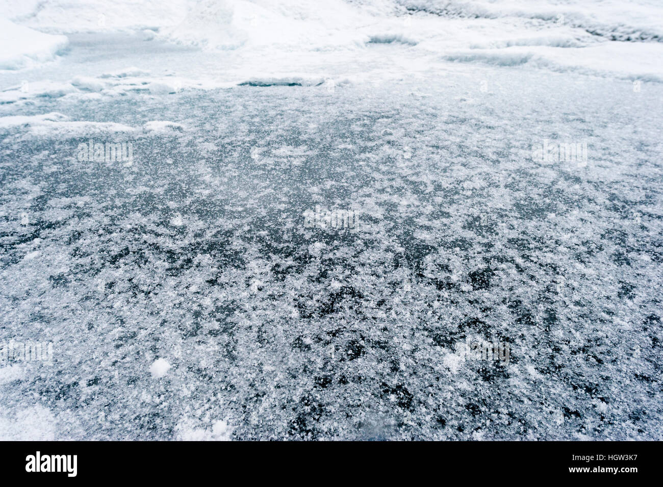 The frozen surface of a melt pond on the surface of the Greenland Ice ...