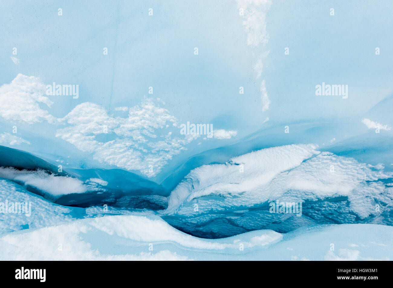 Looking into the depths of a crevasse on the frozen surface of the ...