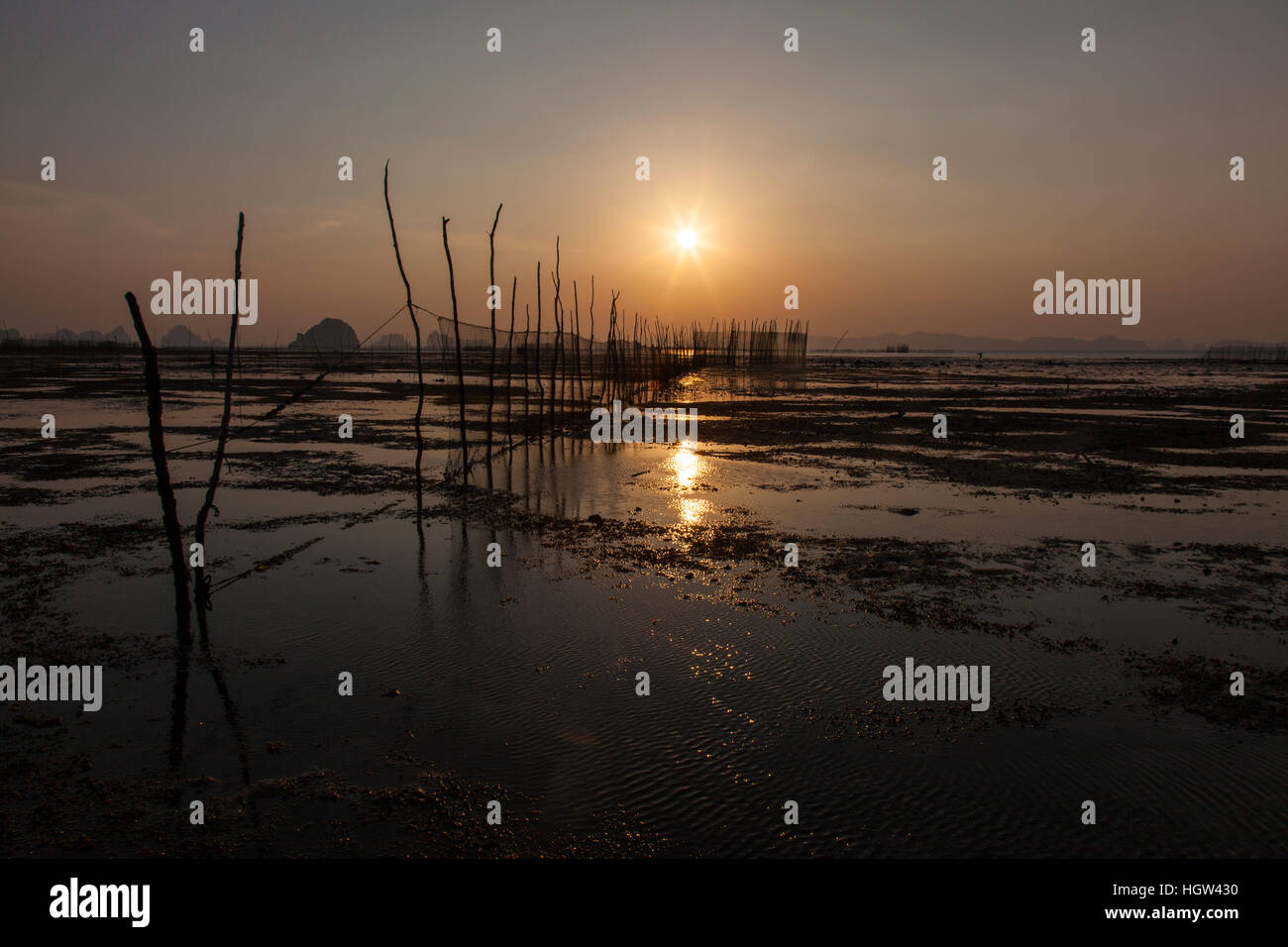 Tide fishing nets at sunset. Thailand Stock Photo - Alamy