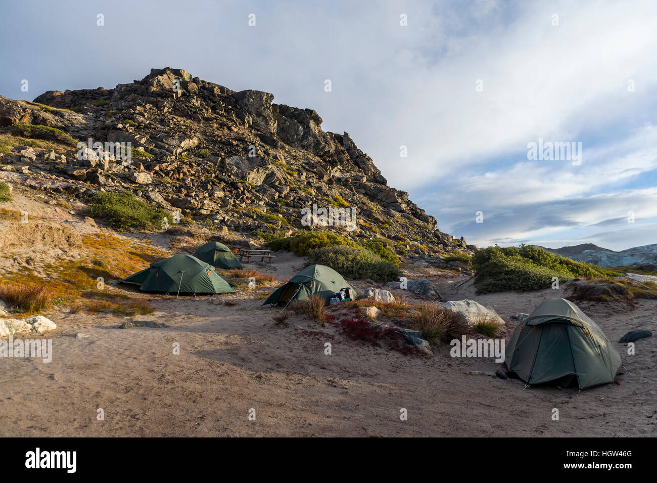 A tented campsite in the shadow of a hill on the arctic tundra Stock ...