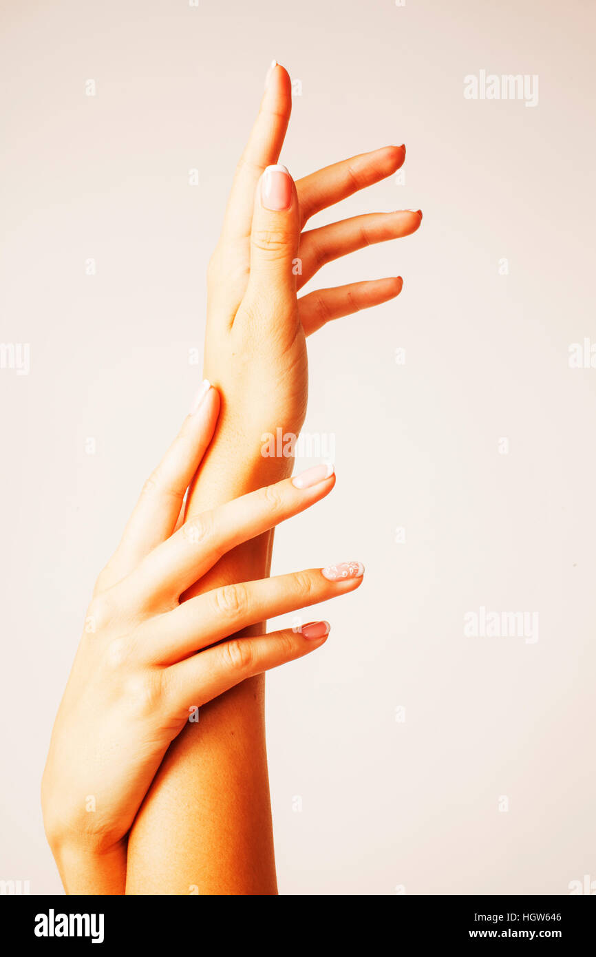 beauty delicate hands with manicure holding flower lily close up ...
