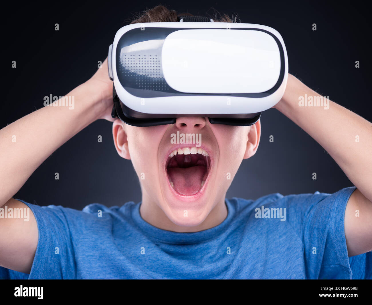 Teen boy in VR glasses Stock Photo - Alamy