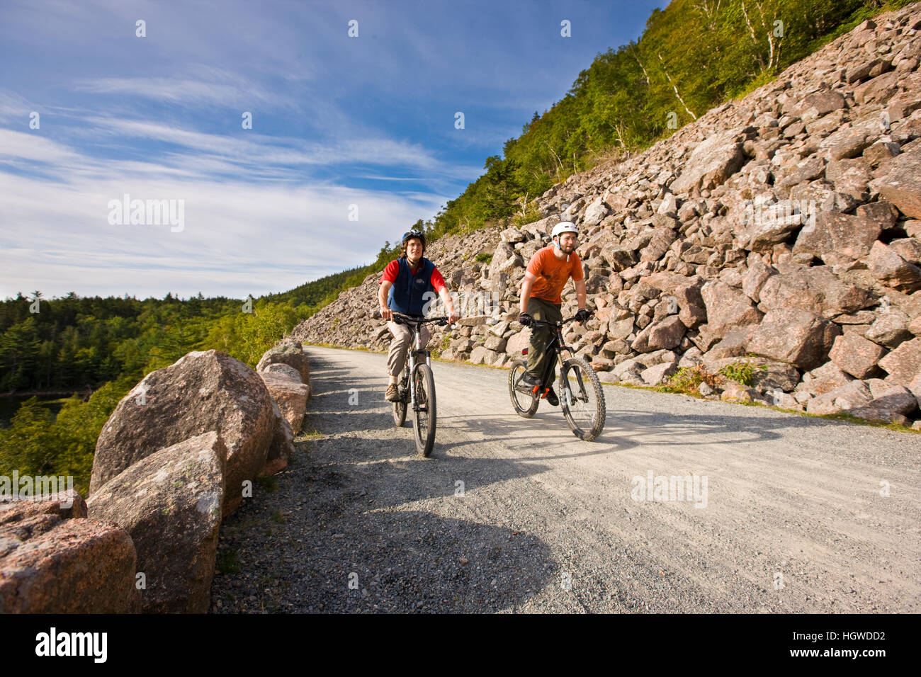Two men biking on a carriage road near Jordan Pond in Maine's Acadia ...