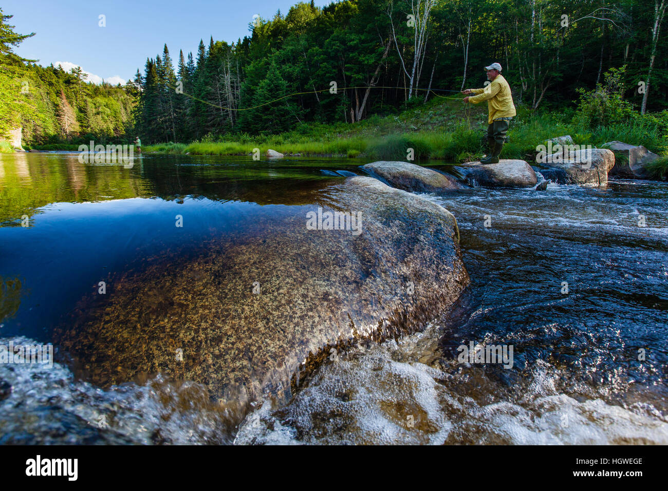 A man fly-fishing for brook trout in Cold Stream in Maine's Northern ...