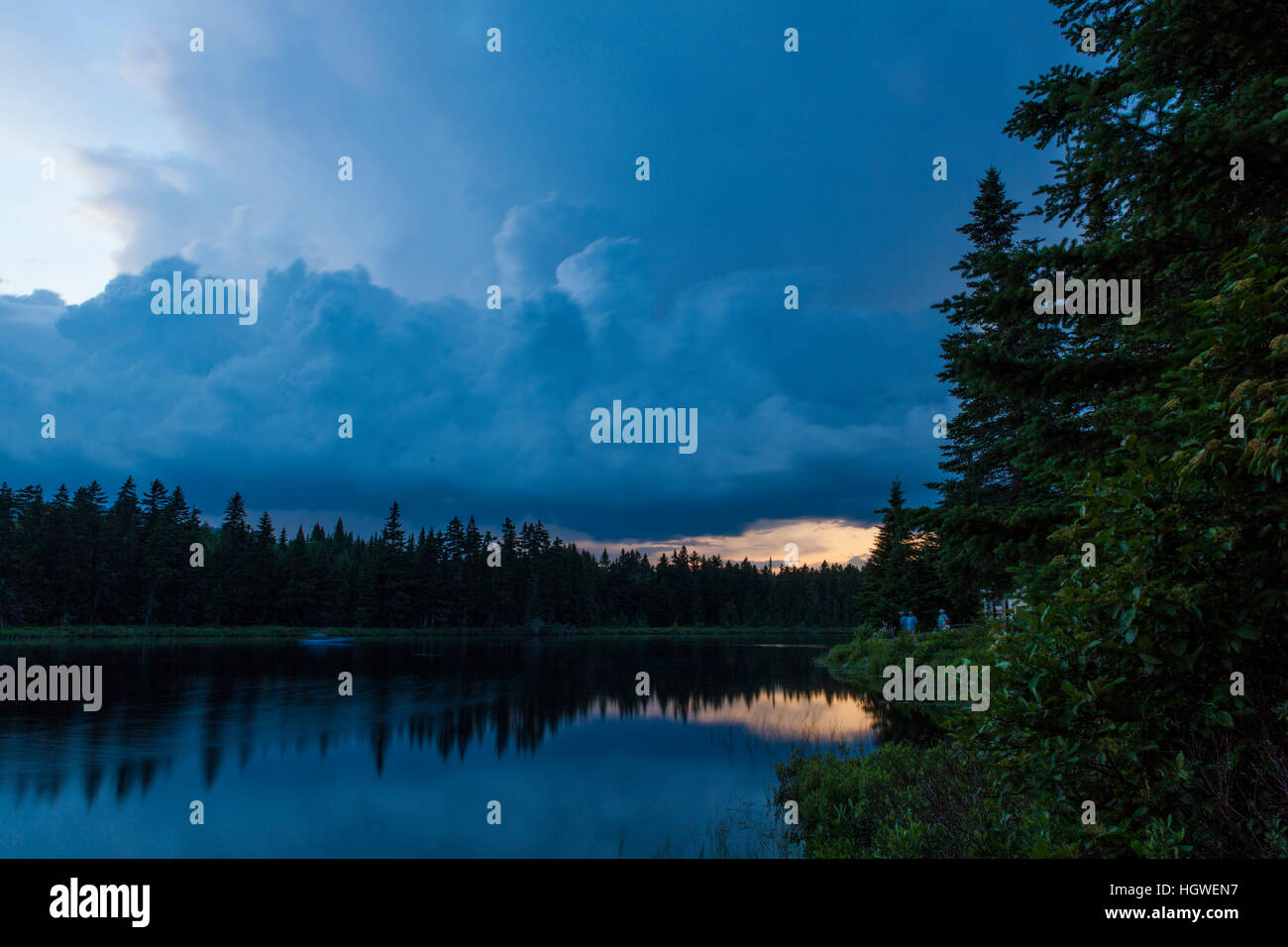 Storm clouds above Durgin Pond in Maine's Northern Forest. Cold Stream ...