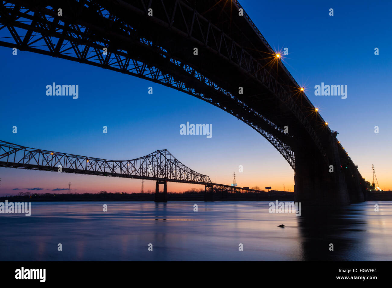 Bridges over the Mississippi River at dawn in St. Louis, Missouri Stock ...