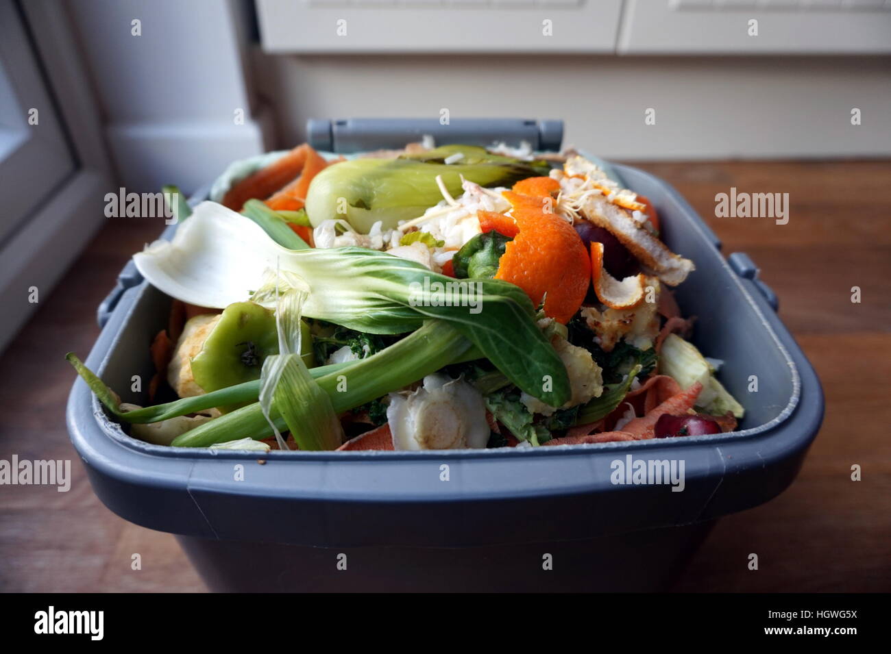 Full domestic food waste caddy, ready to be recycled Stock Photo - Alamy