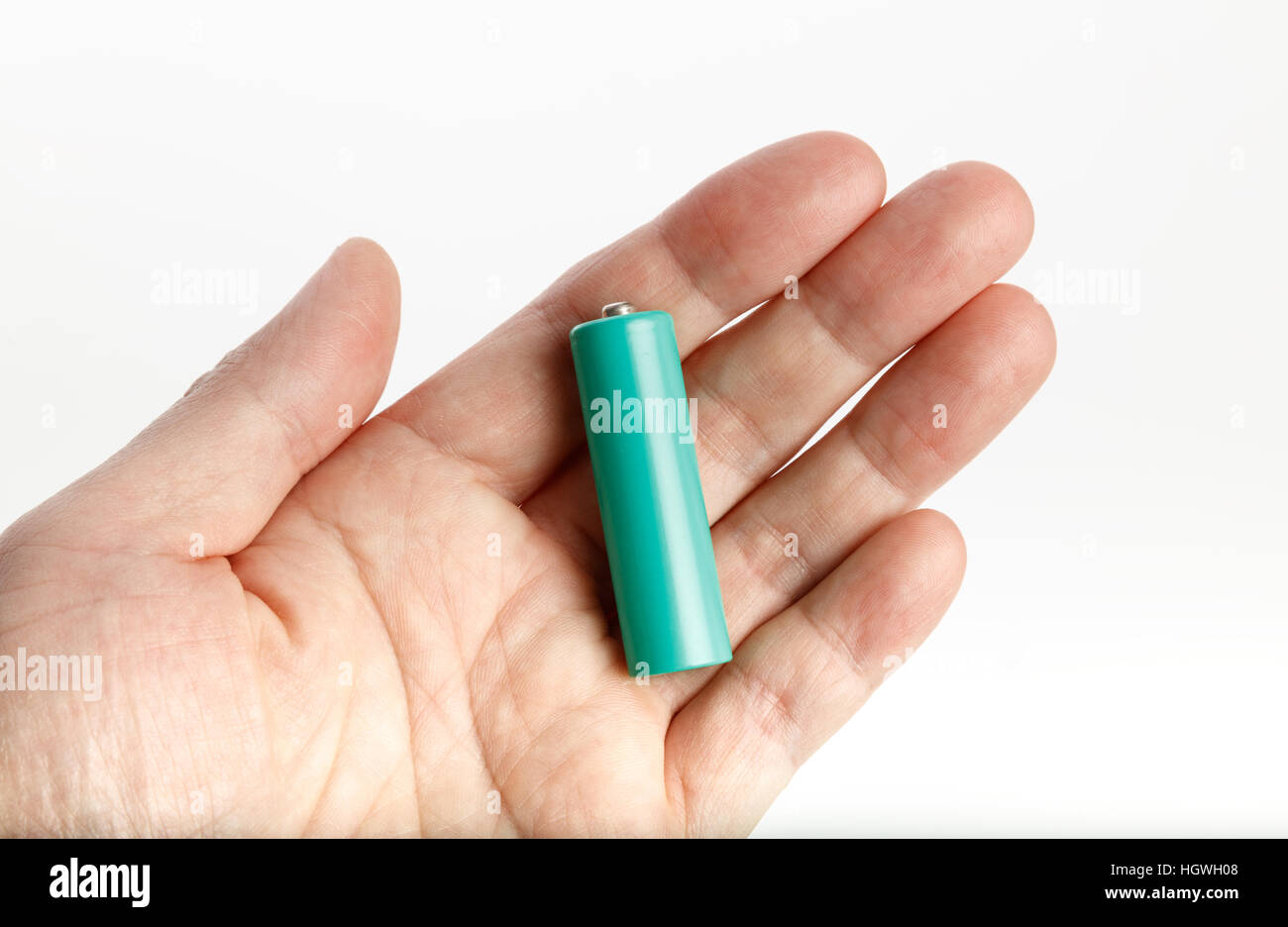 green battery with white background, close up Stock Photo - Alamy