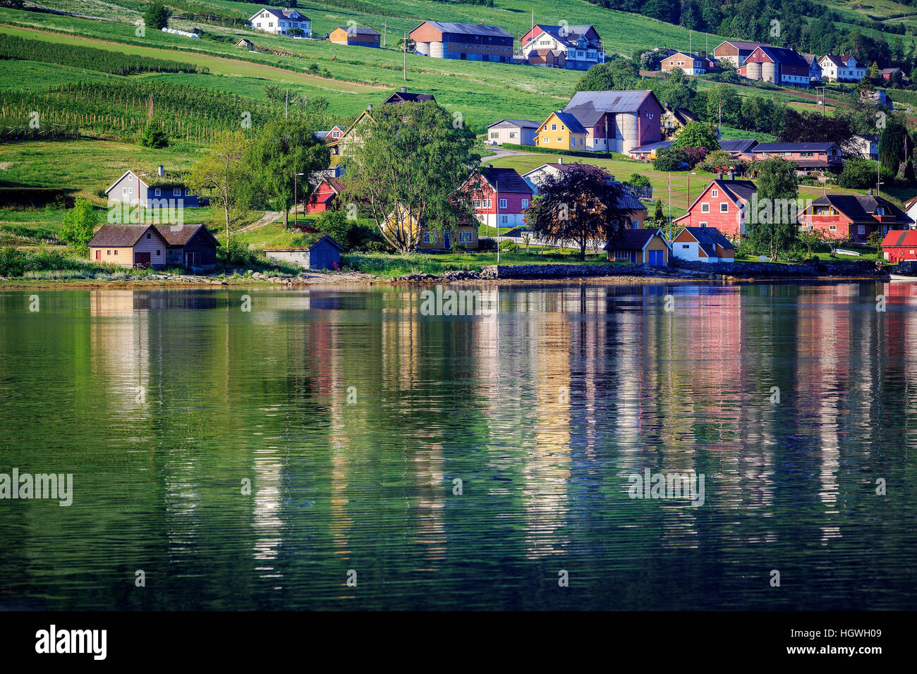 An early morning photo of the houses and farms that line the fjord in ...