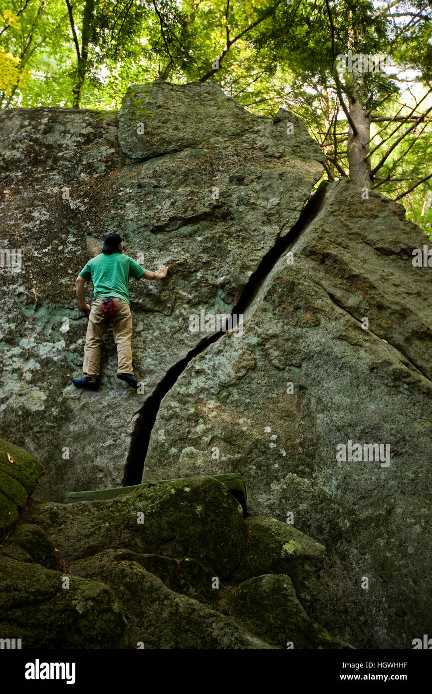 A man bouldering in "The Boulders" section of New Hampshire's ...