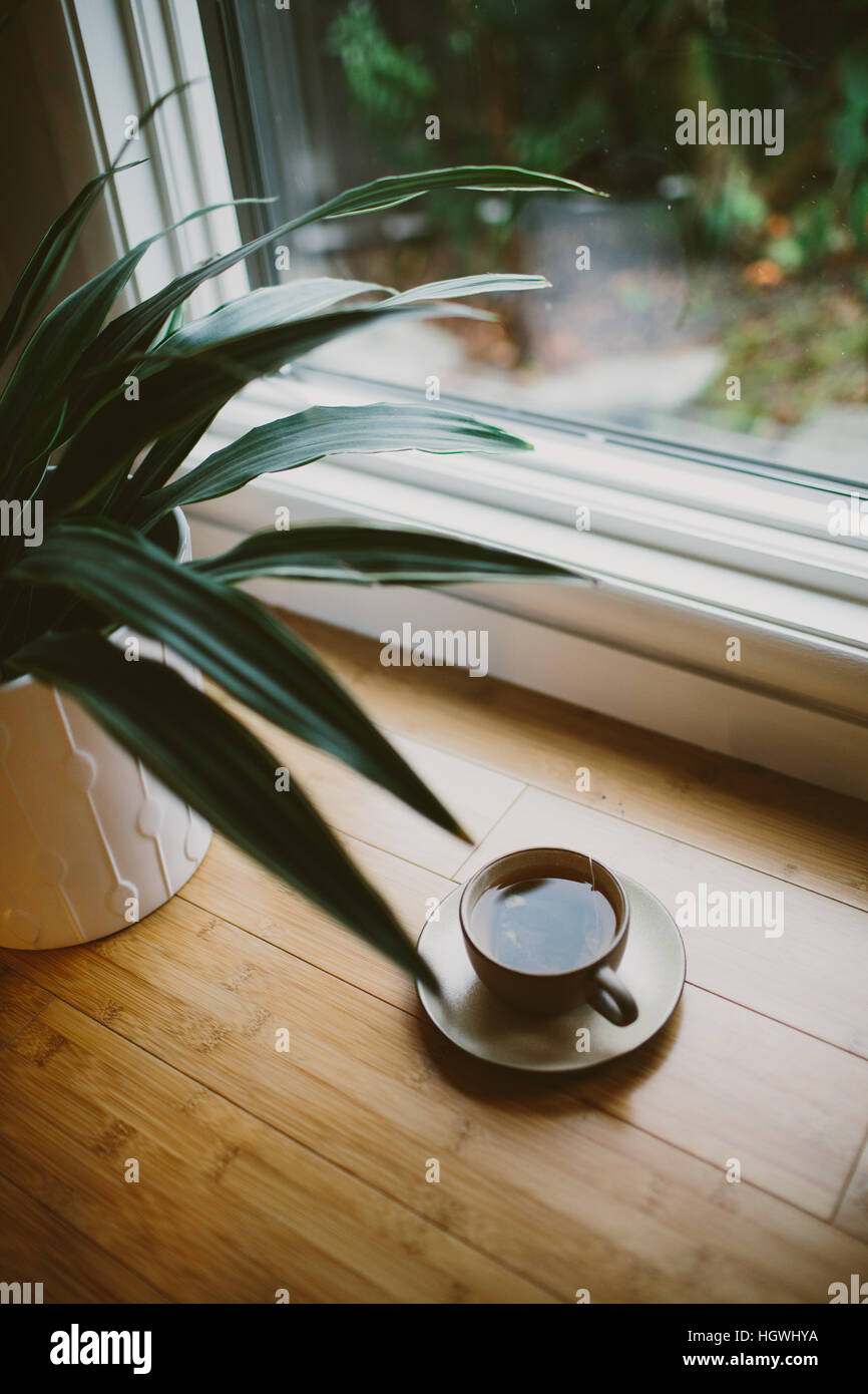cup of tea sitting in a windowsill Stock Photo - Alamy