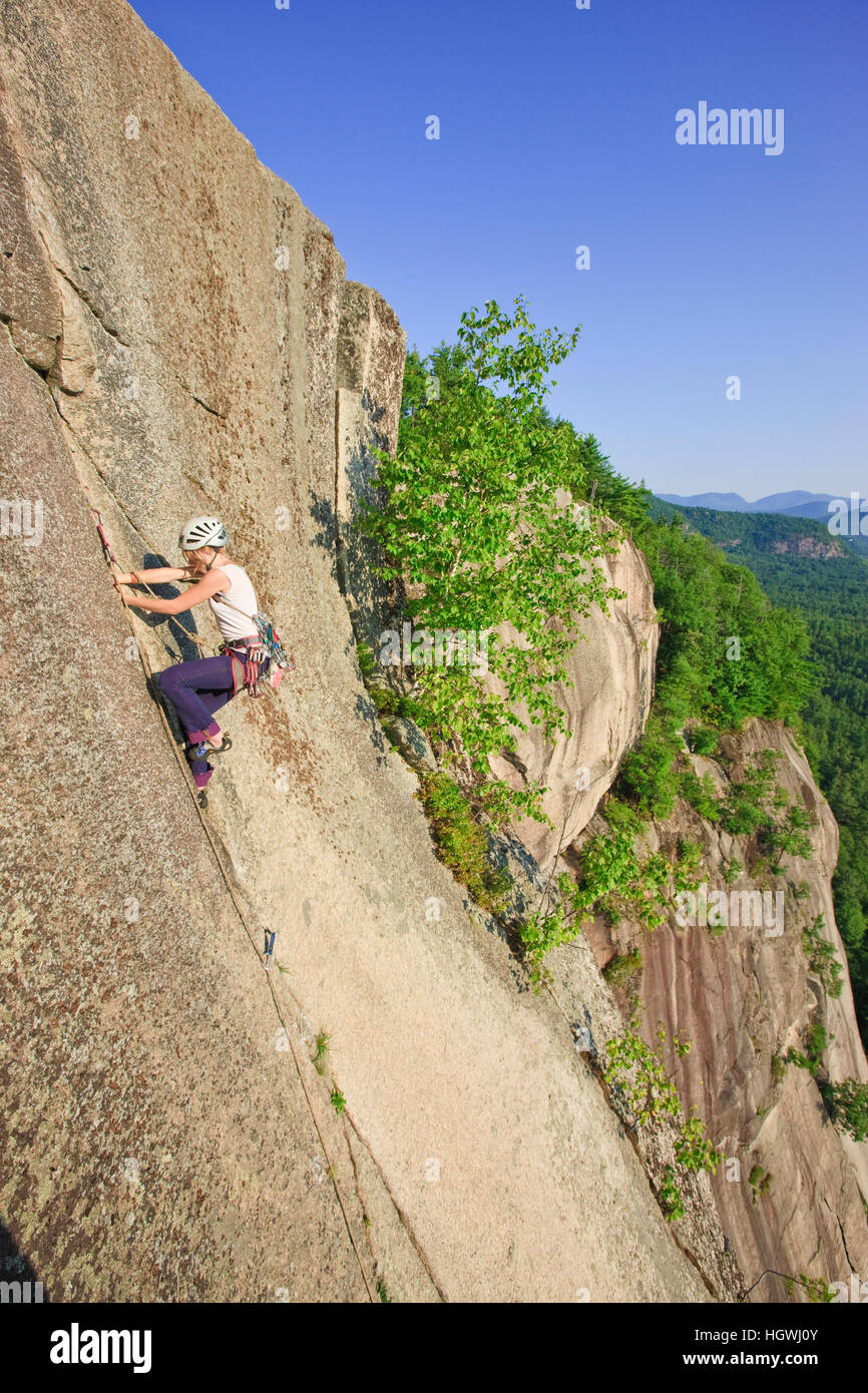 A woman leads a climb of "Top of the Prow" on Cathedral Ledge. Echo ...