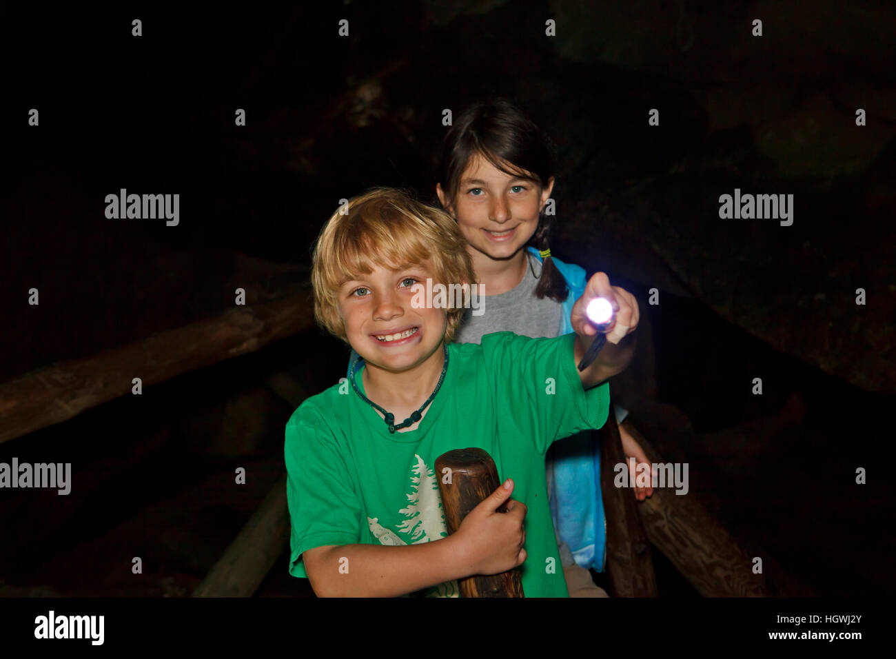 A young brother and sister explore a cave at Lost River Gorge in New ...