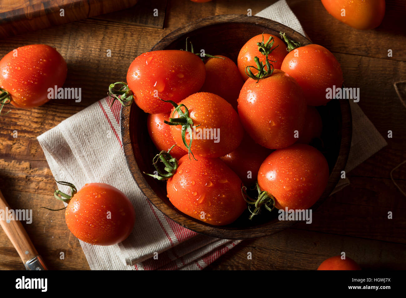 Raw Red Organic Roma Tomatoes Ready for Cooking Stock Photo - Alamy