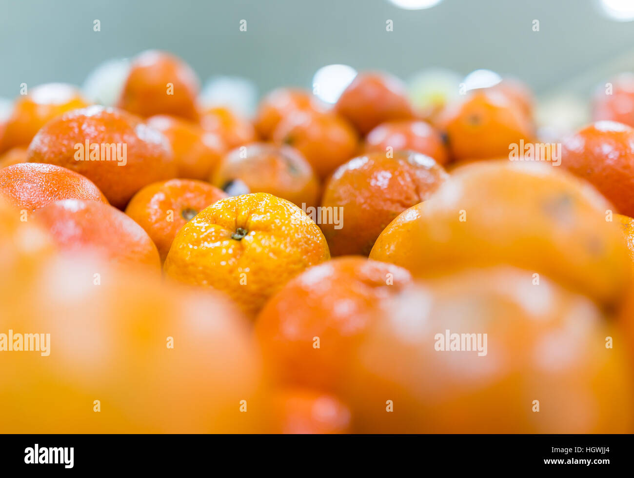 Macro closeup of display of many tangerine oranges in store Stock Photo ...