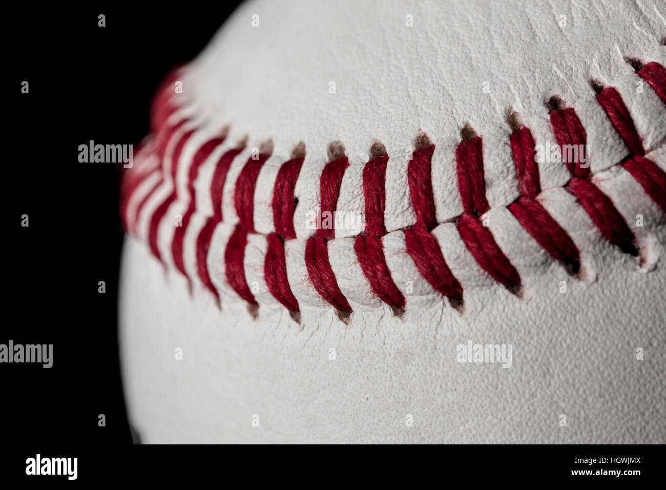 Baseball Ball closeup on a black Background Stock Photo - Alamy