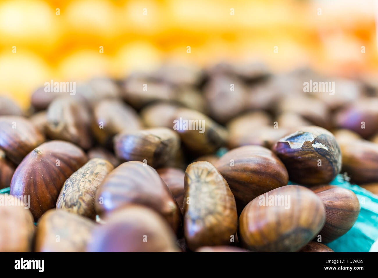 Unshelled chestnuts in shells on display at market Stock Photo - Alamy