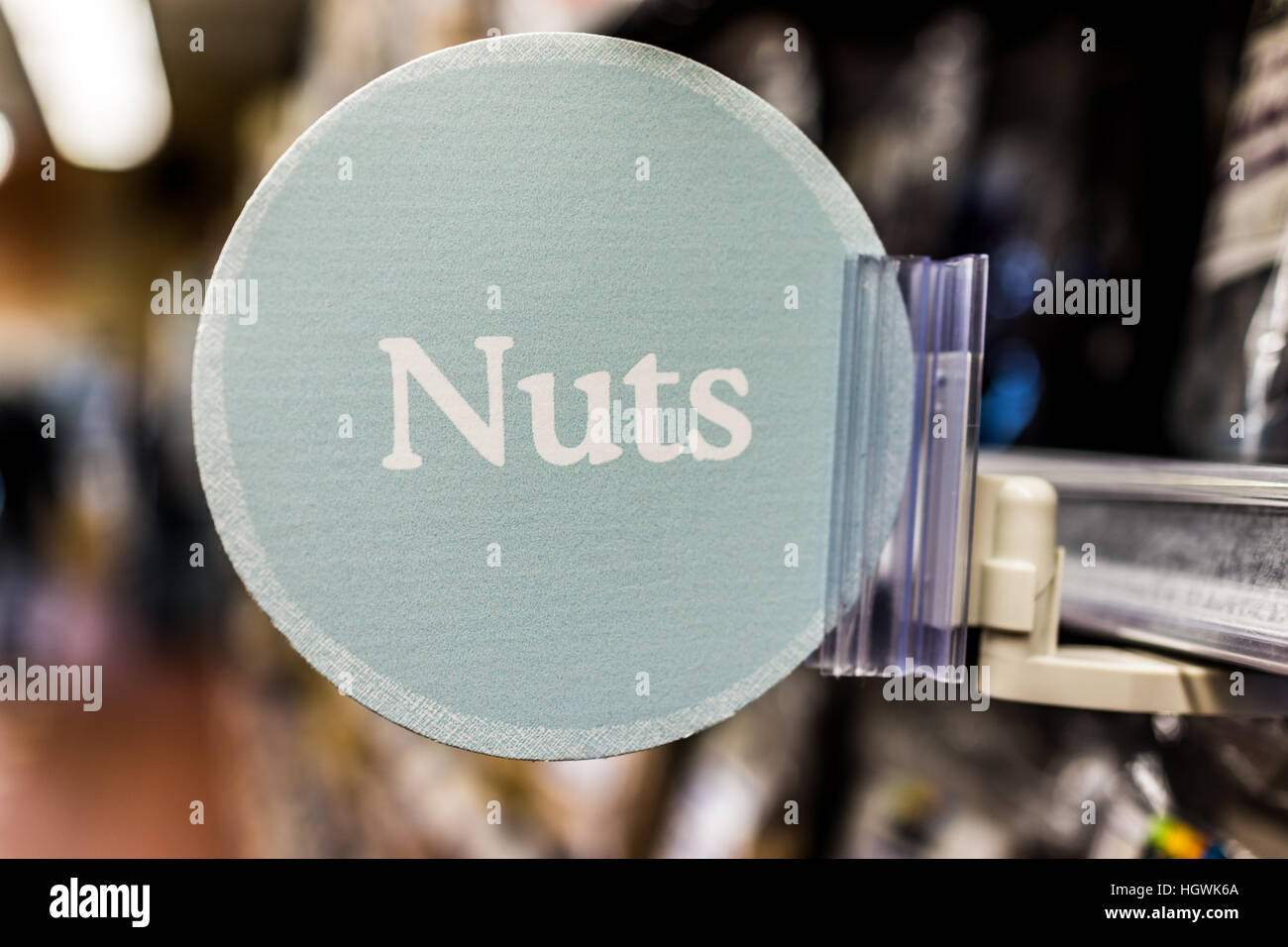 Circular light blue sign with nuts word Stock Photo - Alamy