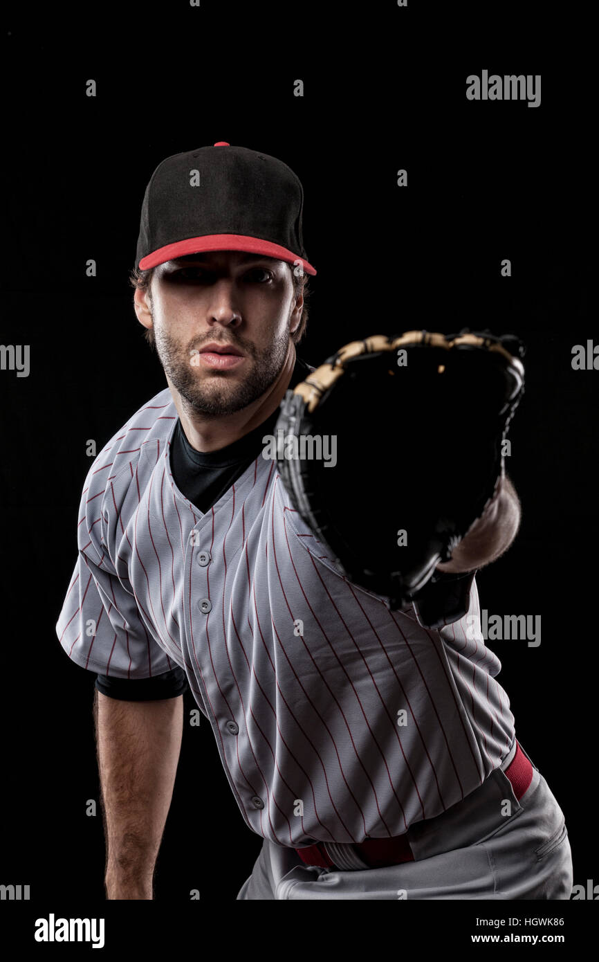 Baseball Player catching a ball on a black background. Studio Shot ...