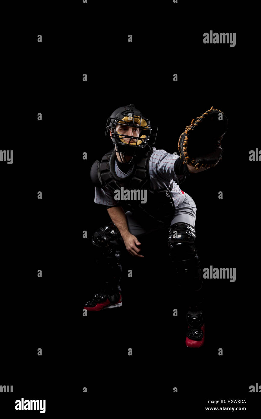 Baseball Player, catcher waiting a ball, on a black background. Studio ...