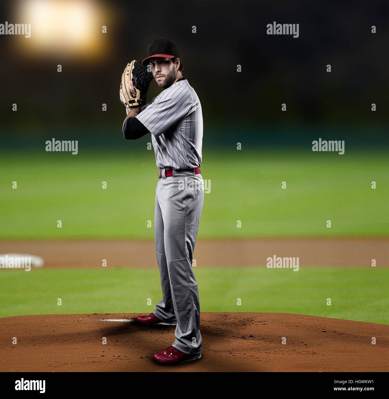 Pitcher Player throwing a ball, on a baseball Stadium Stock Photo - Alamy