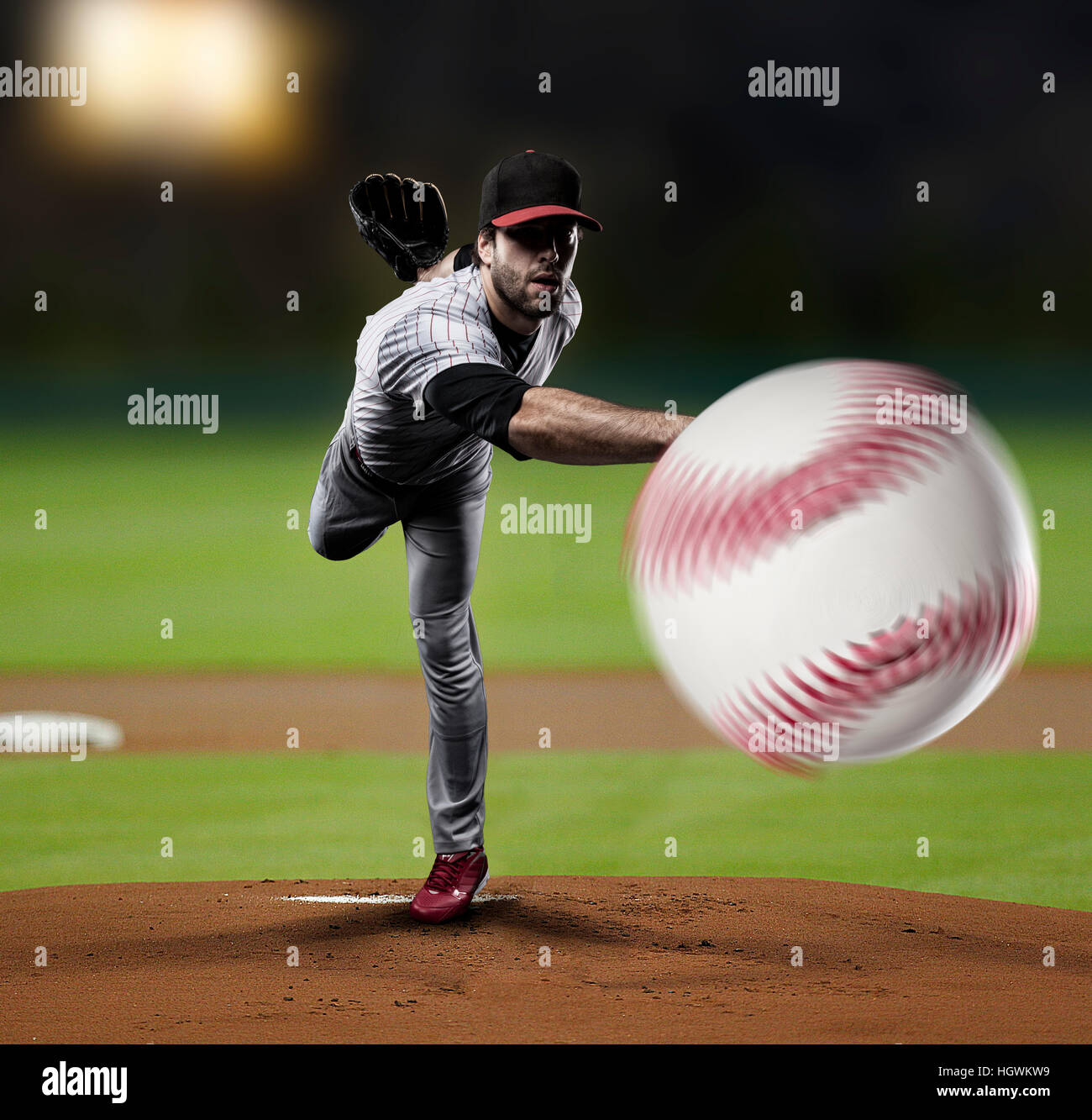 Pitcher Player throwing a ball, on a baseball Stadium Stock Photo - Alamy