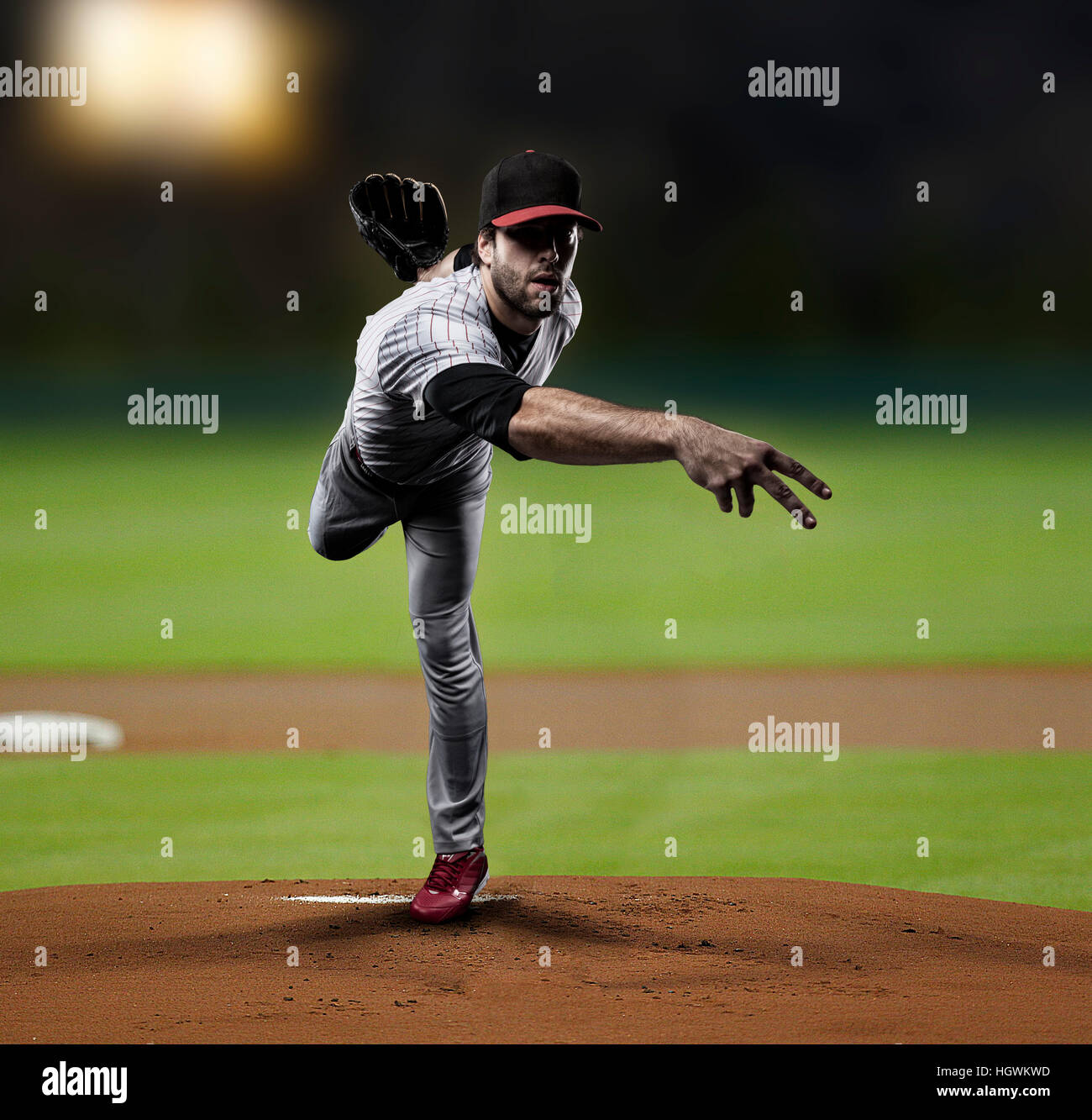 Pitcher Player throwing a ball, on a baseball Stadium Stock Photo - Alamy