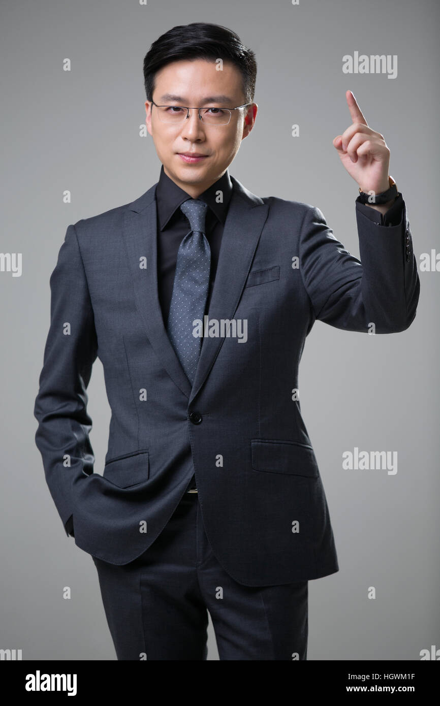 Businessman successful gesturing pointing hi-res stock photography and ...