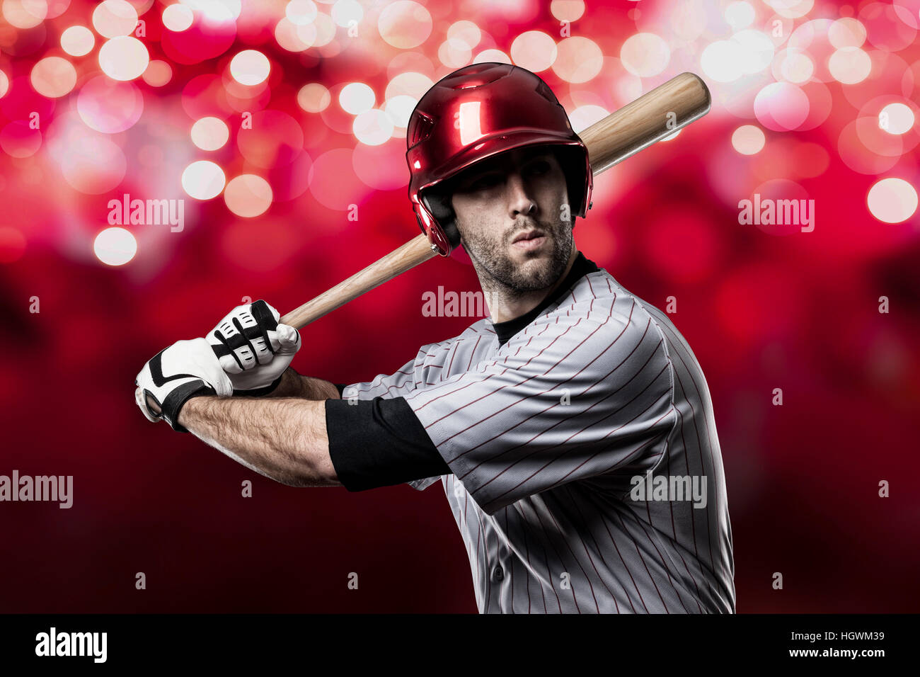 Baseball Player on a Red Uniform on red lights background Stock Photo ...