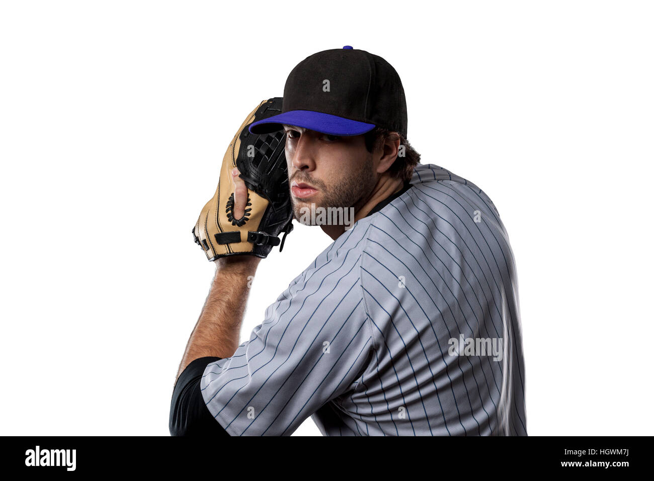 Baseball Player in a blue uniform, on a white background Stock Photo ...