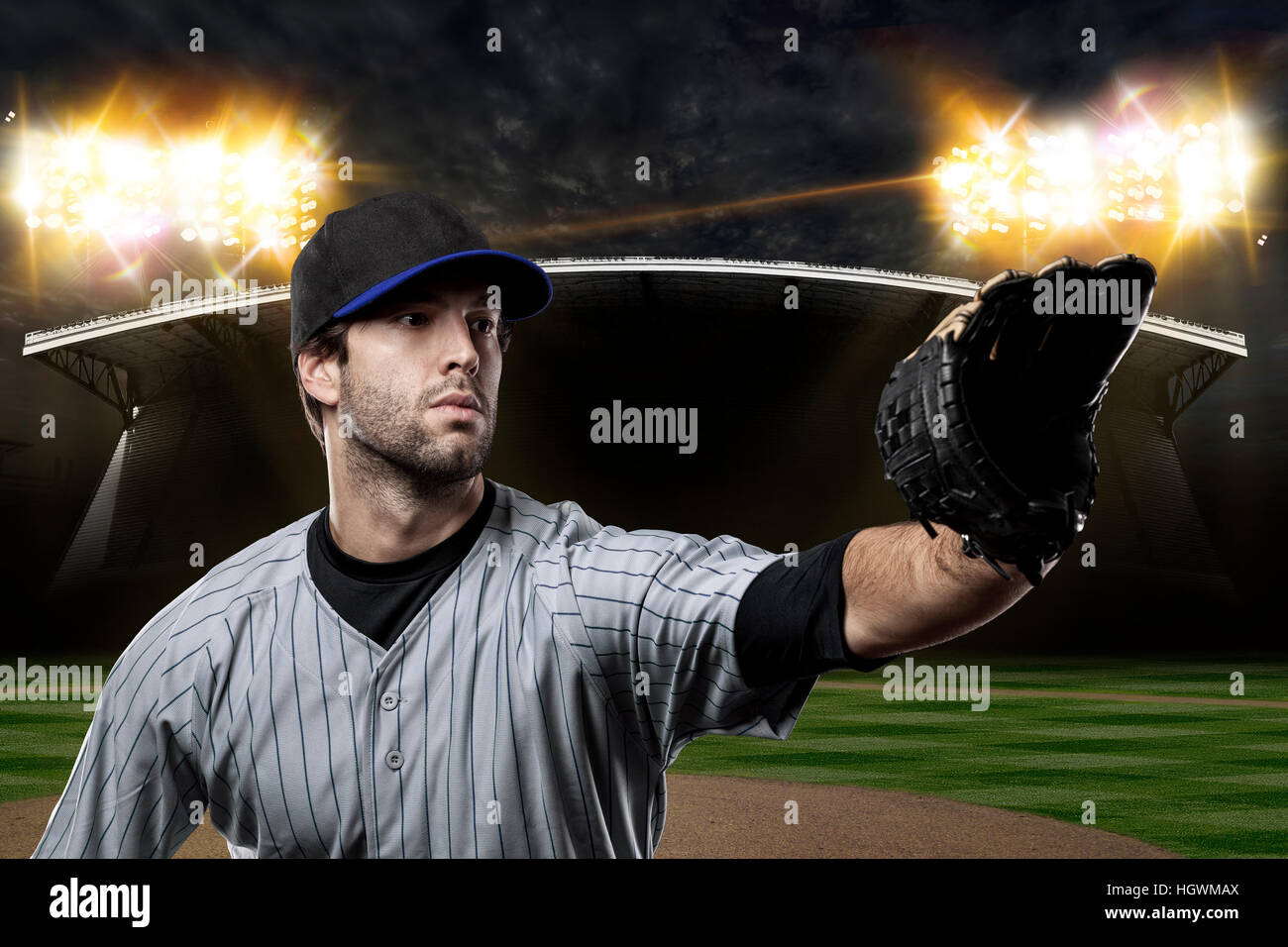 Baseball Player on a Blue Uniform on baseball Stadium Stock Photo - Alamy