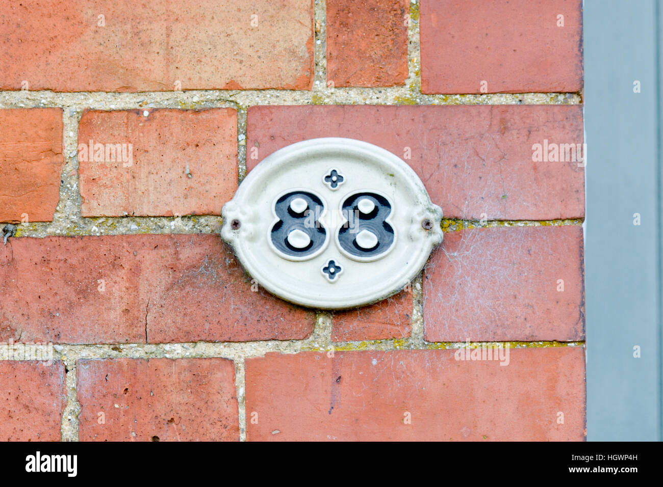 House Number 88 sign on red brick wall Stock Photo - Alamy