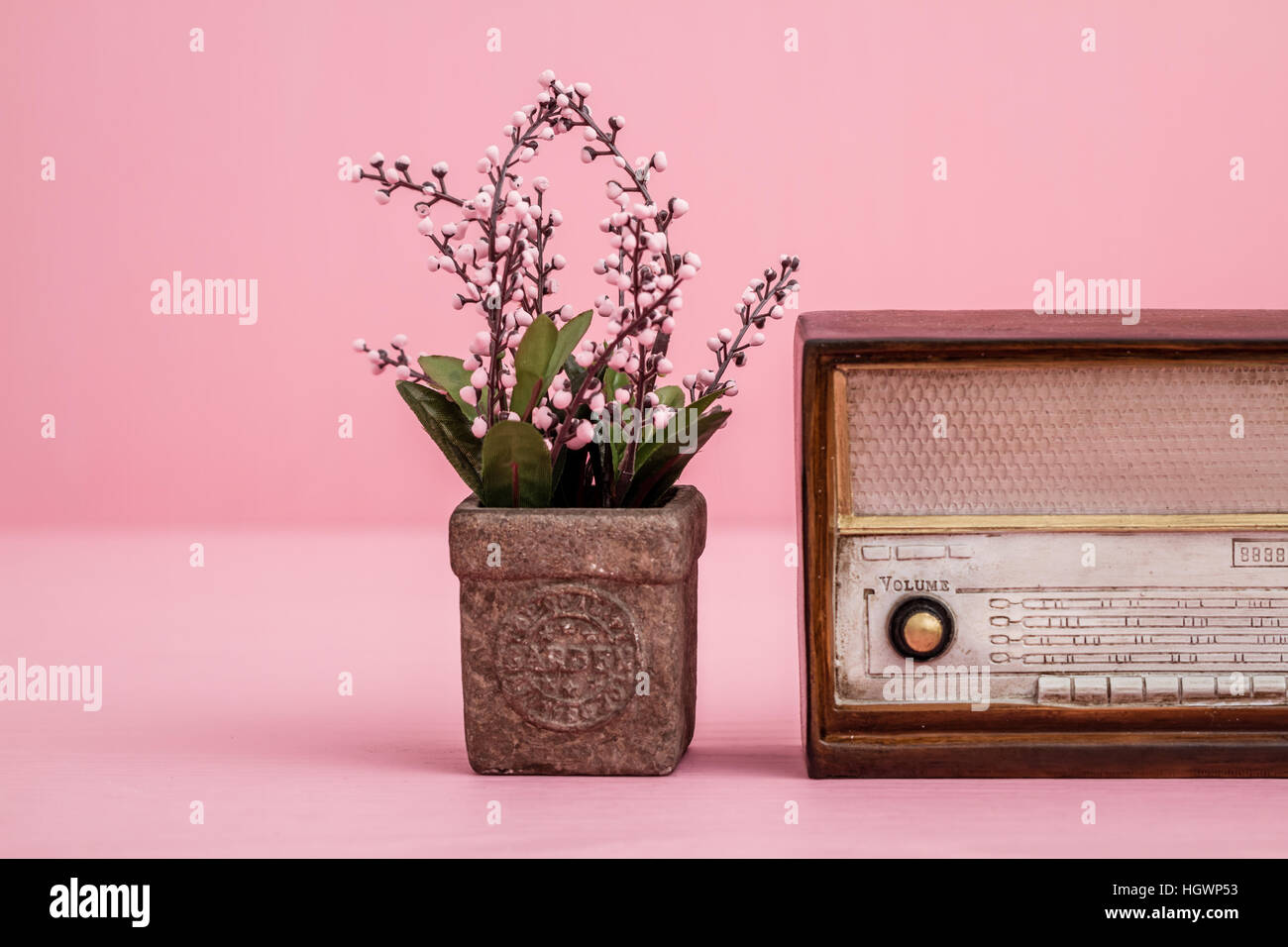 Decorative radio with retro look on pink background with copy space ...