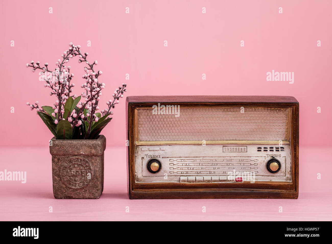Decorative radio with retro look on pink background with copy space ...