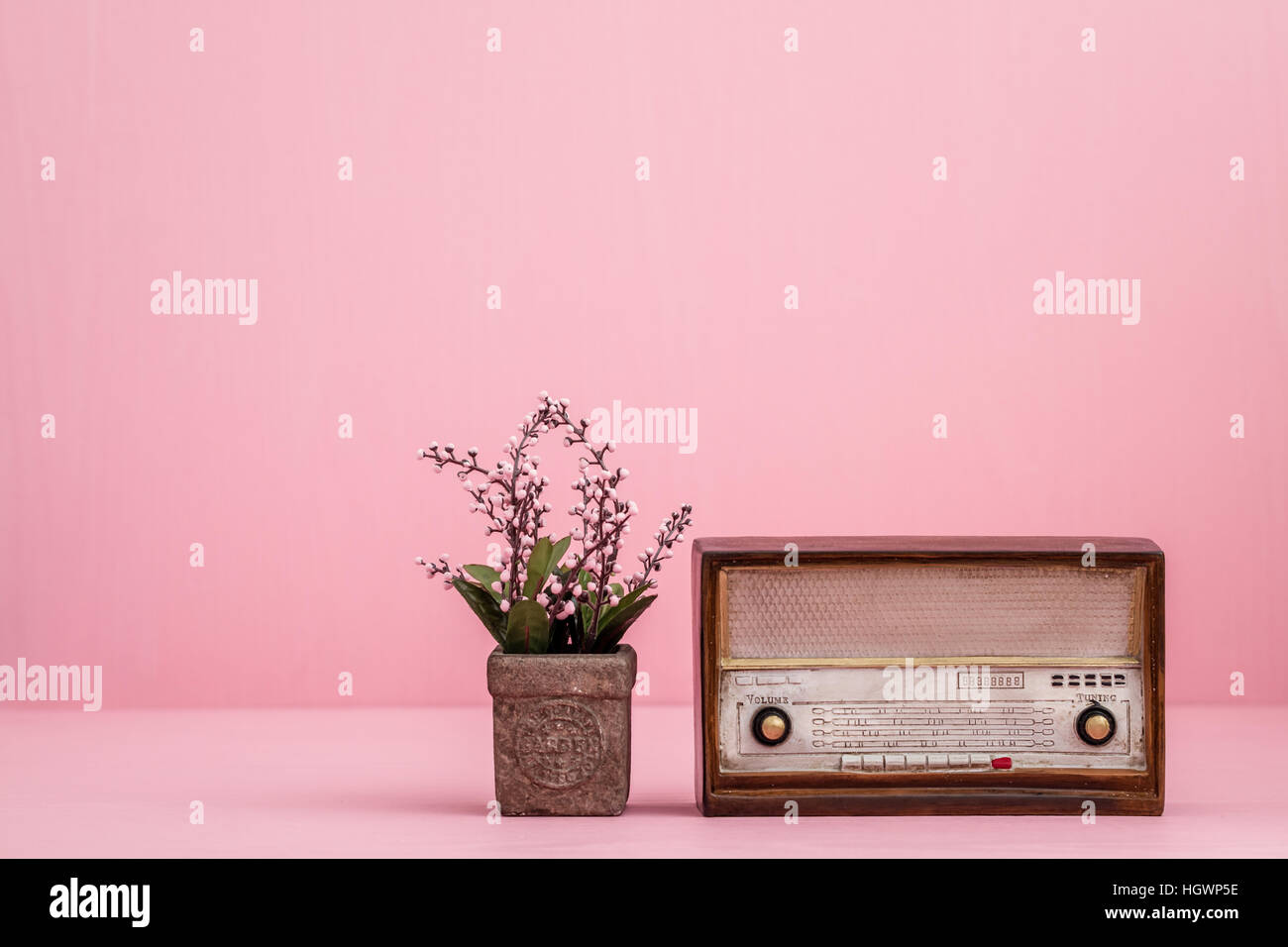 Decorative radio with retro look on pink background with copy space ...