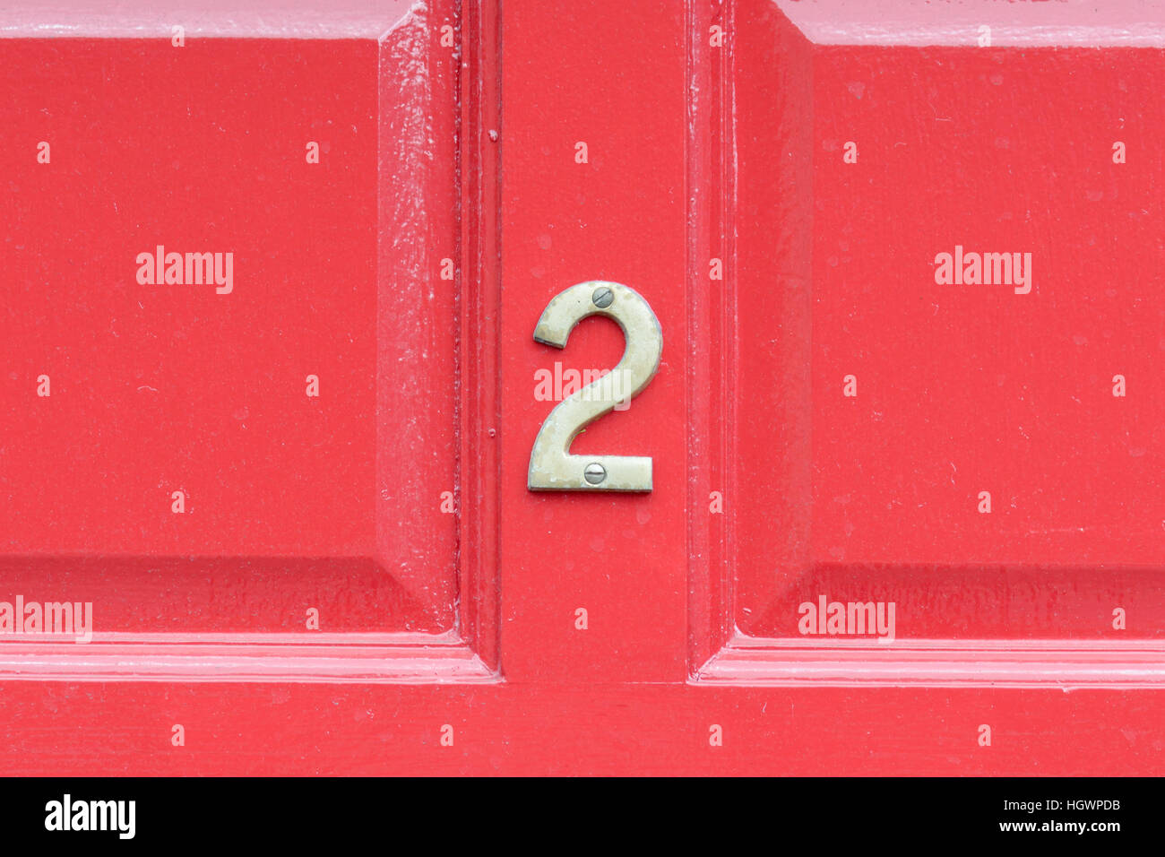 House Number 2 sign on red door Stock Photo - Alamy