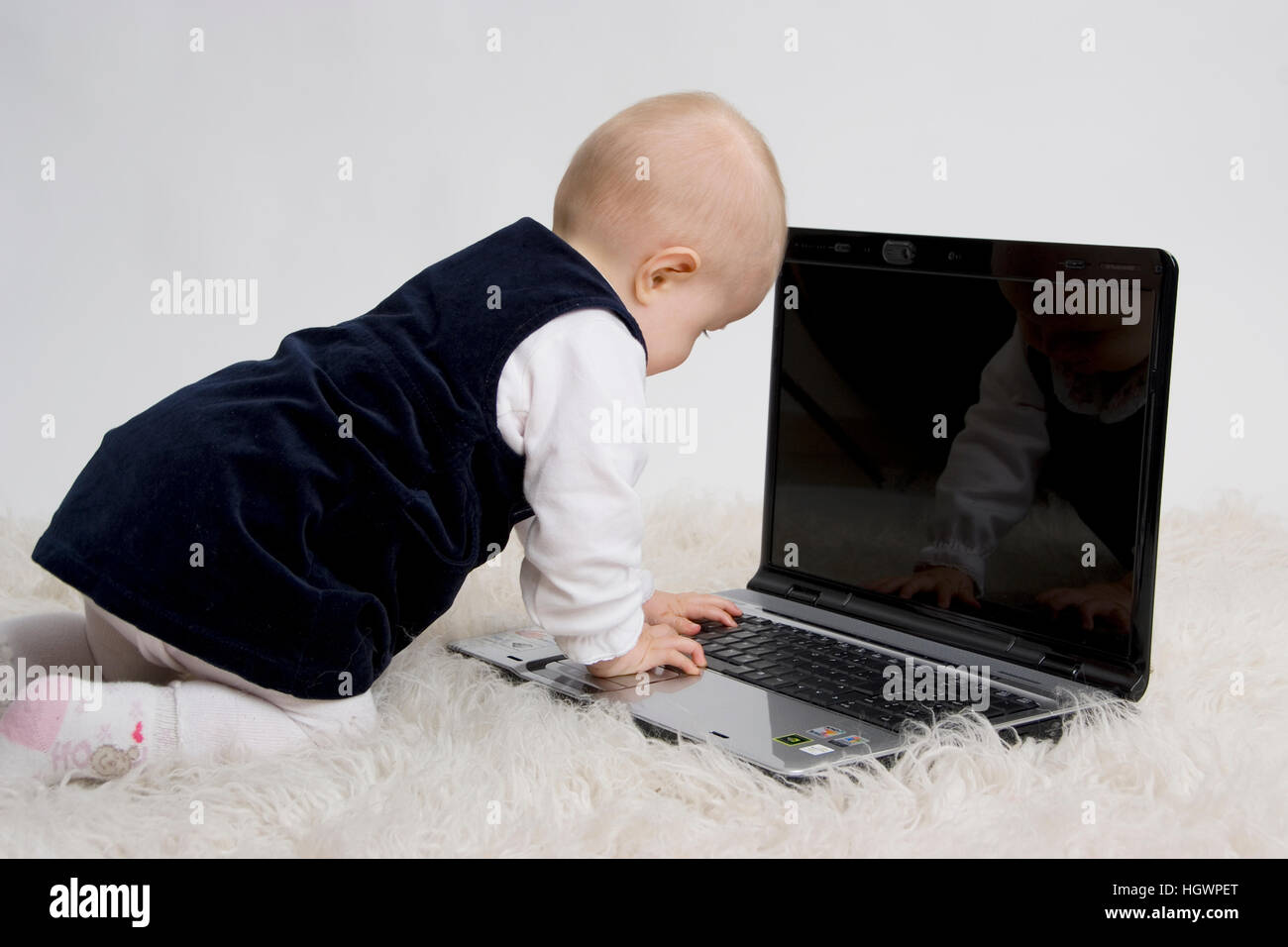 Little child using laptop Stock Photo - Alamy
