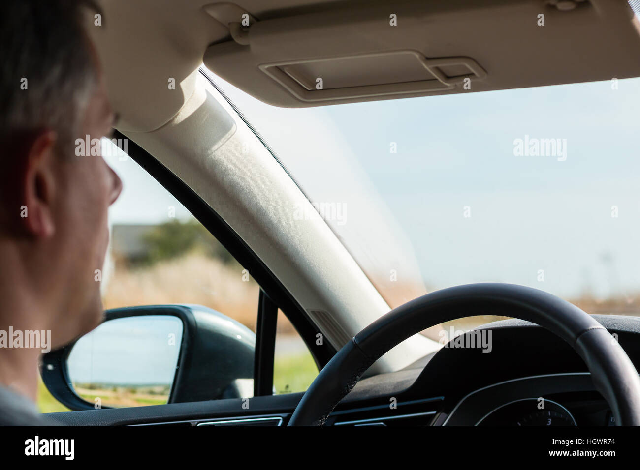 Concentrated man drives a car Stock Photo - Alamy