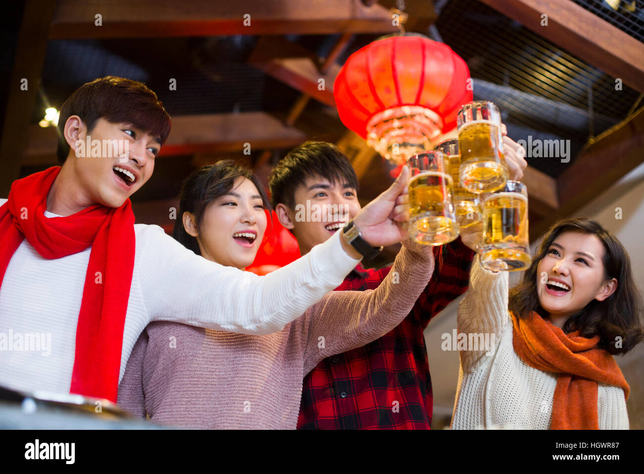 Young friends toasting for Chinese new year Stock Photo - Alamy