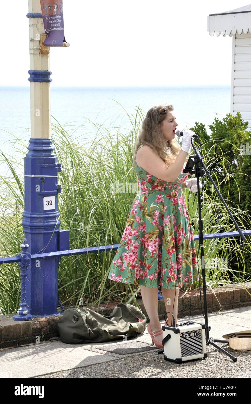 Female singing busker hi-res stock photography and images - Alamy