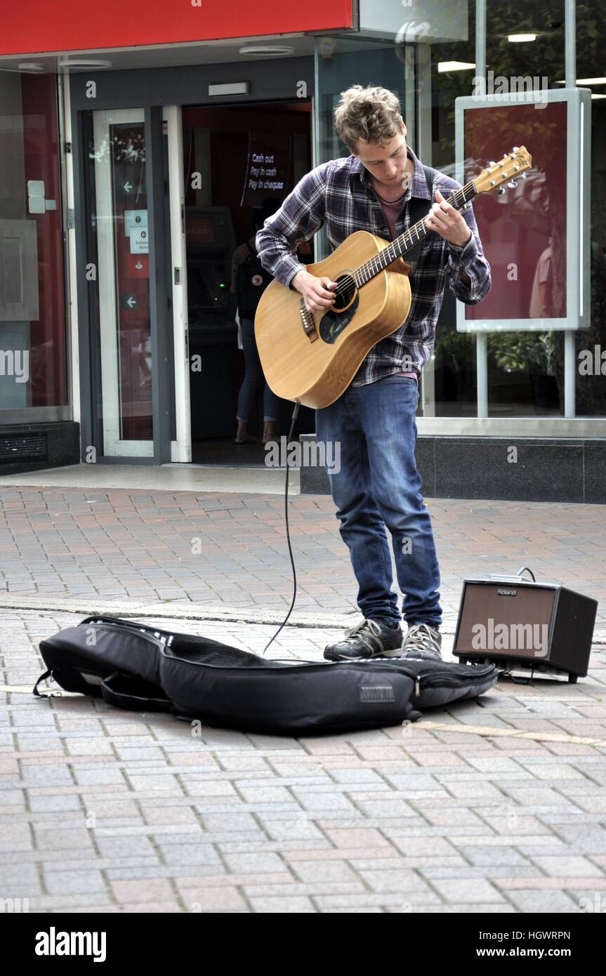 Male busker in shopping centre PT Stock Photo - Alamy