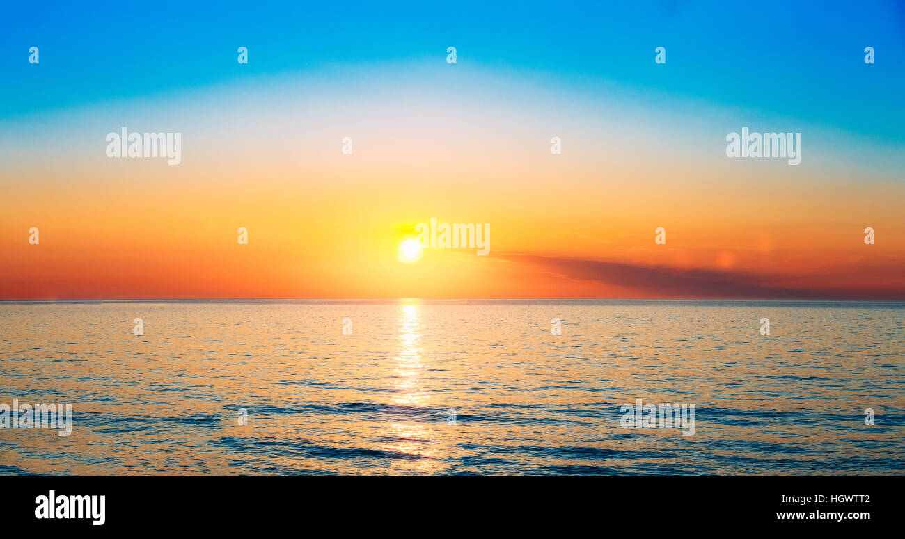 Sun Is Setting On Horizon At Sunset Sunrise Over Sea Or Ocean. Tranquil ...