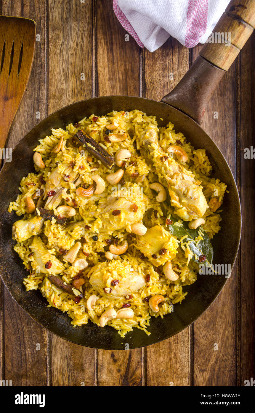 Sour berry chicken pulao in a pan Stock Photo - Alamy