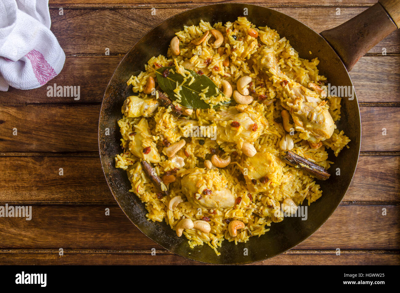 Sour berry chicken pulao in a pan Stock Photo - Alamy