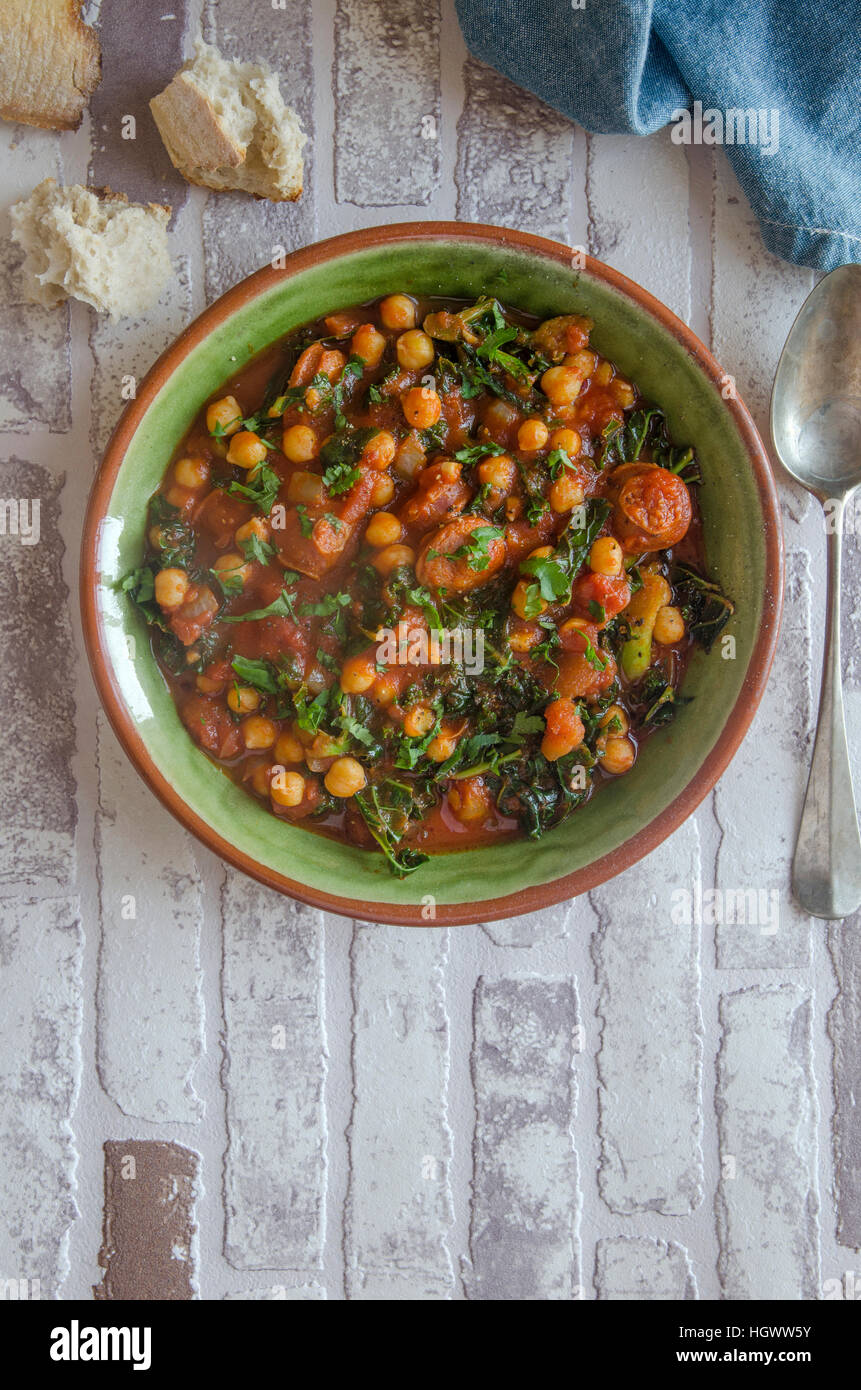 Chickpea, chorizo and kale stew with rustic bread Stock Photo - Alamy