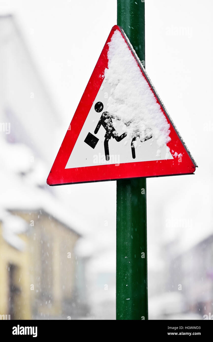School zone crossing road sign covered with snow in winter Stock Photo ...