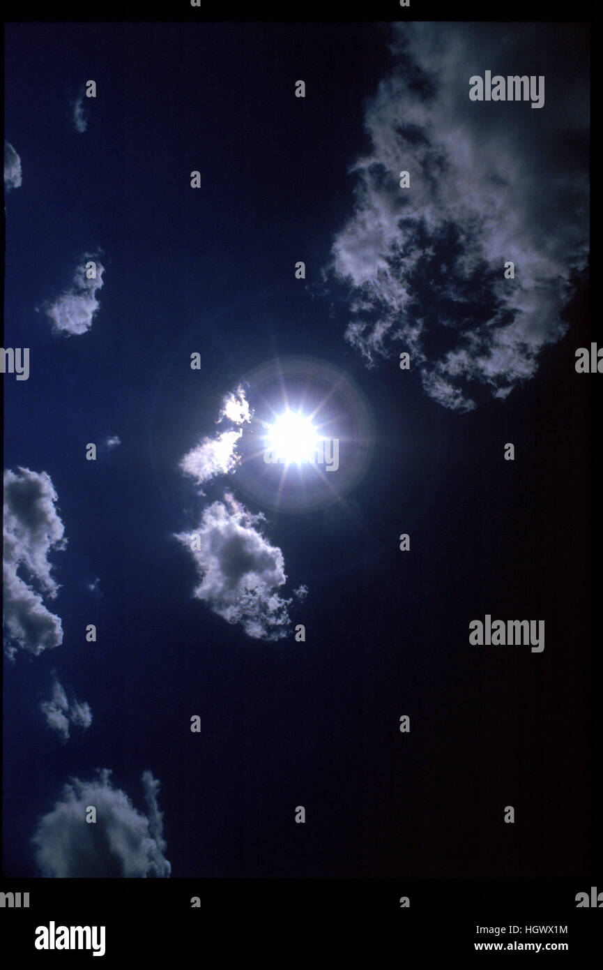 Sunburst, sun, clouds Stock Photo - Alamy