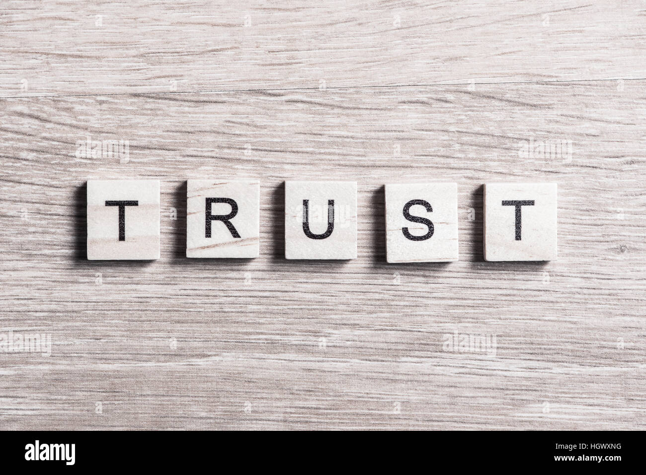 Trust word of wooden elements Stock Photo - Alamy