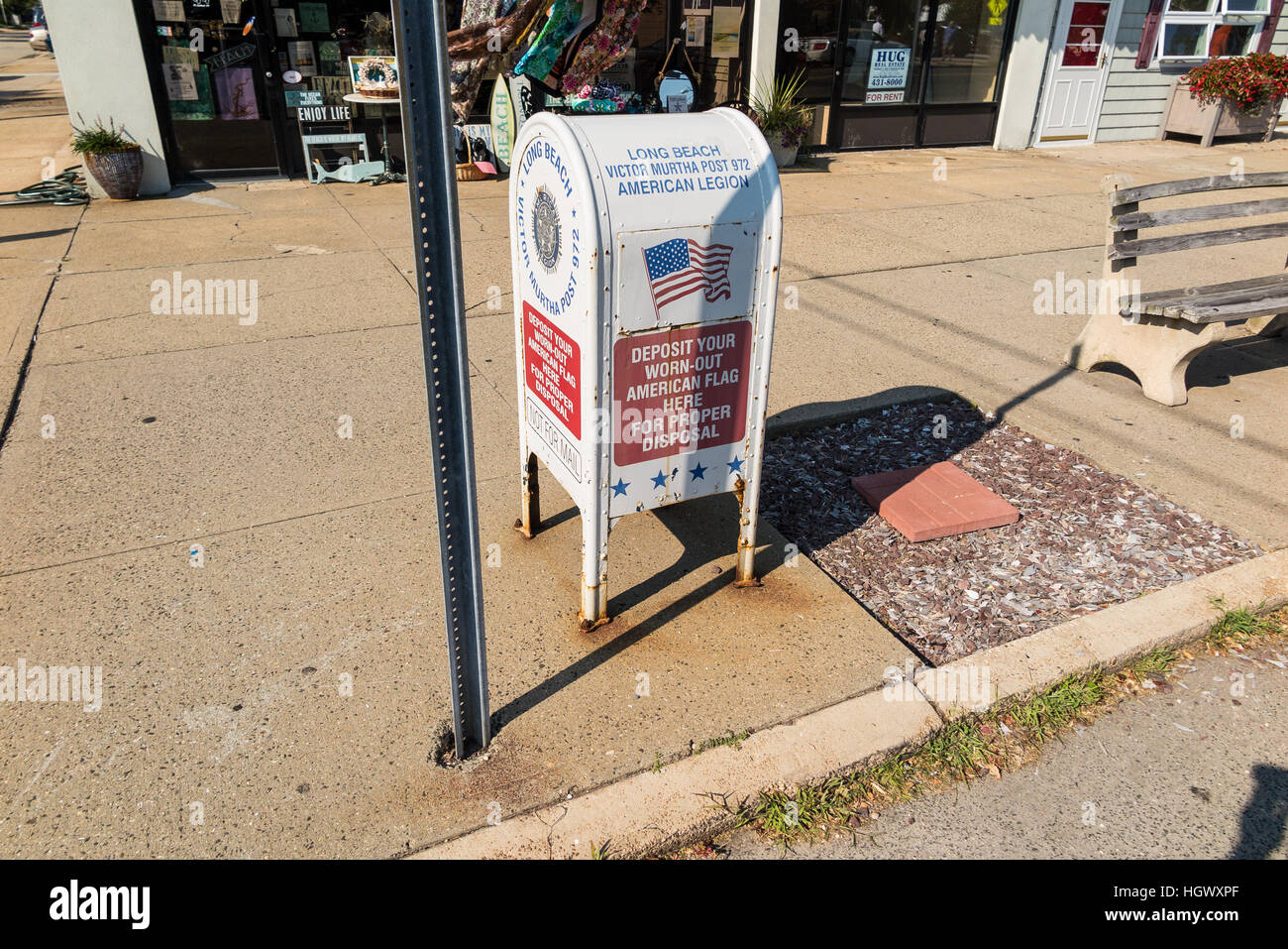 Worn flag deposit box on the sidewalk Stock Photo - Alamy