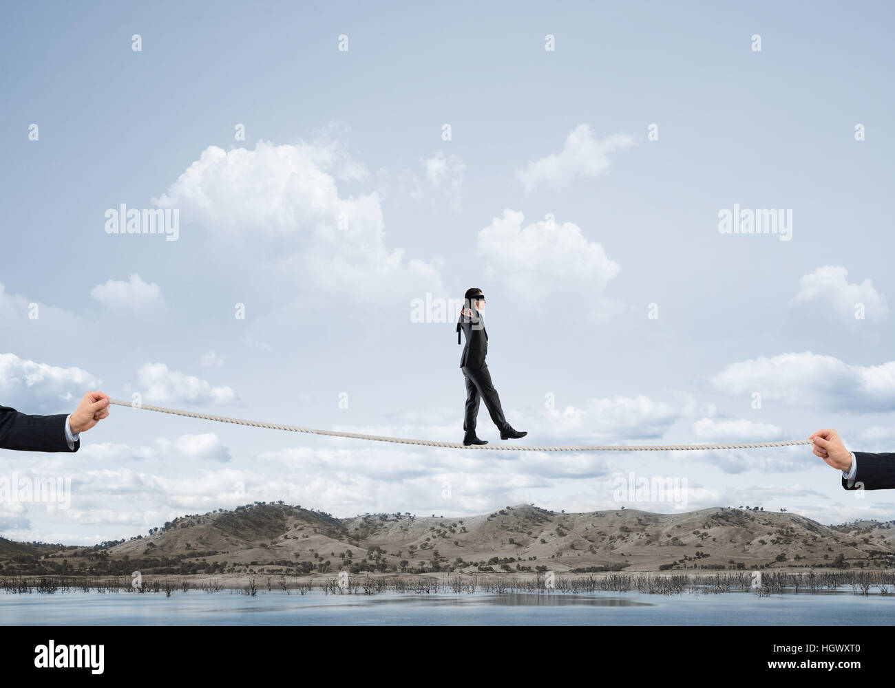 Business concept of risk support and assistance with man balancing on ...